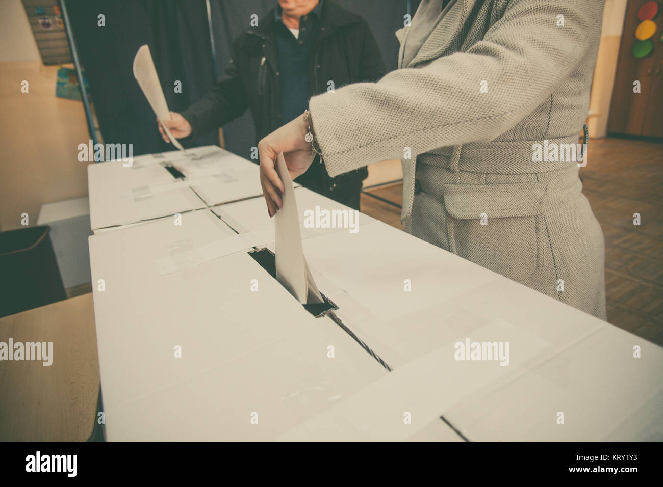 Person voting at polling station Stock Photo - Alamy