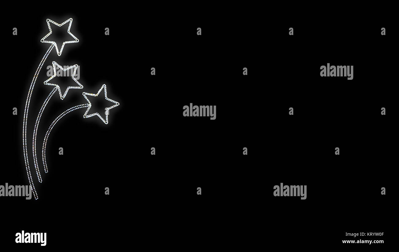 Three white LED light style shooting stars against black background ...