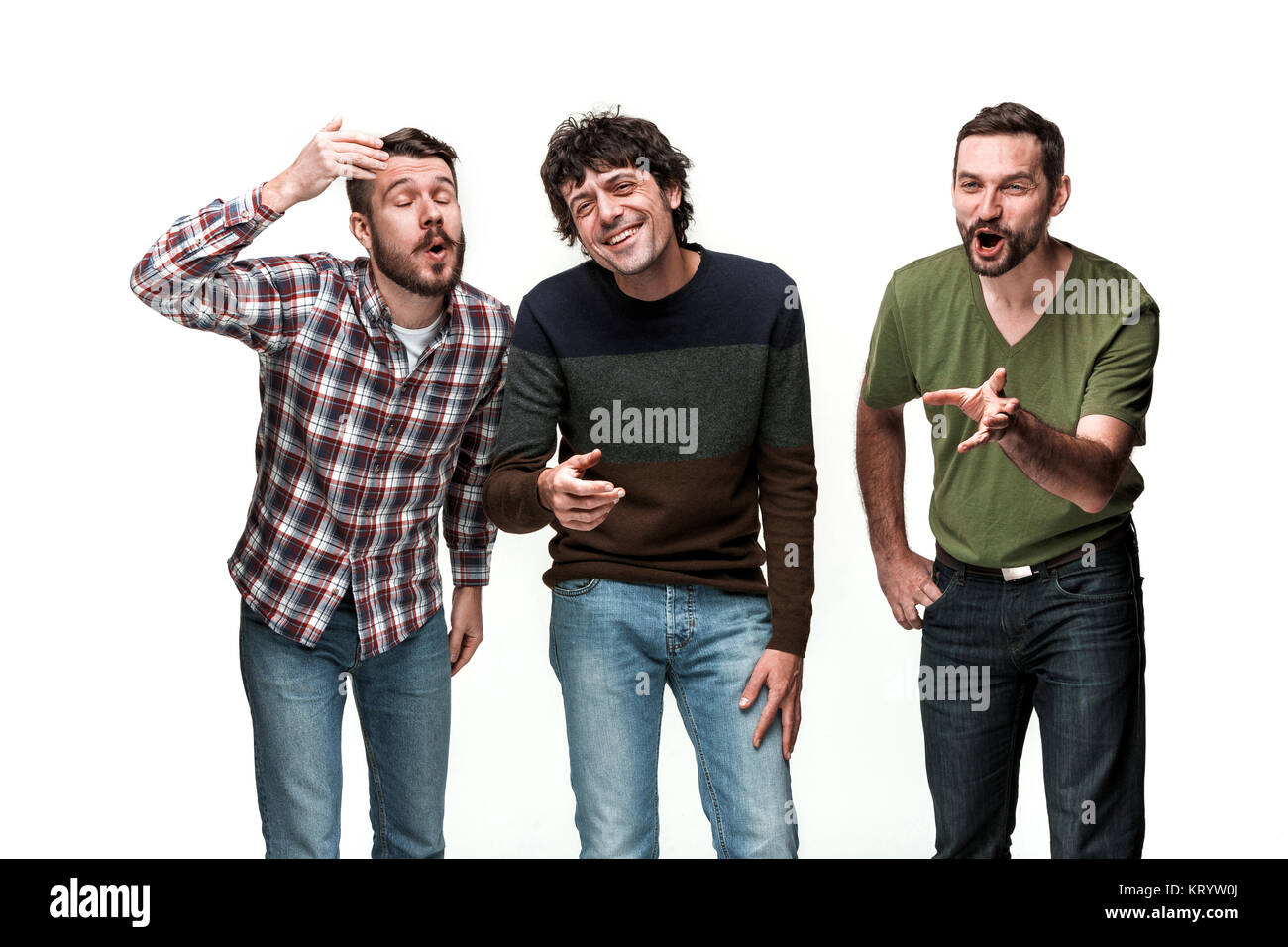 The three men are smiling, looking at camera Stock Photo - Alamy