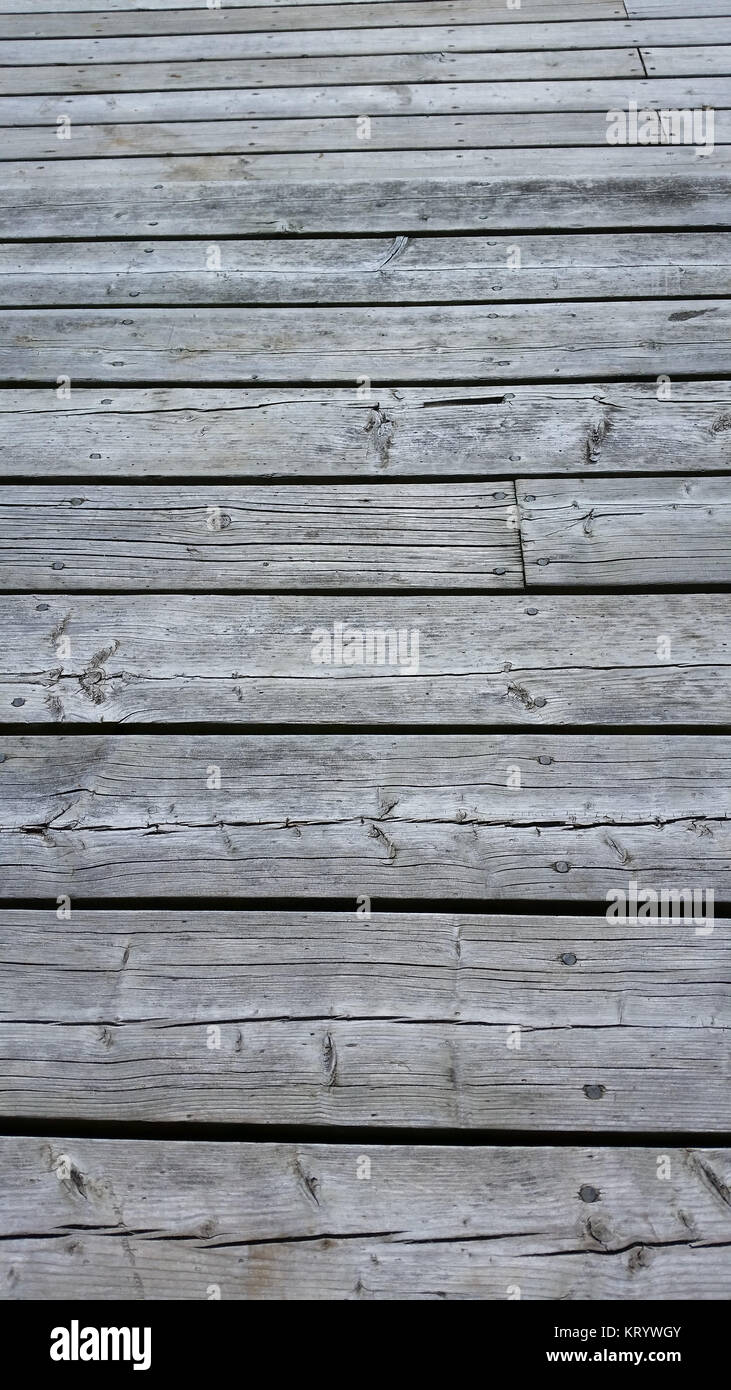 Weathered silver wooden decking Stock Photo - Alamy