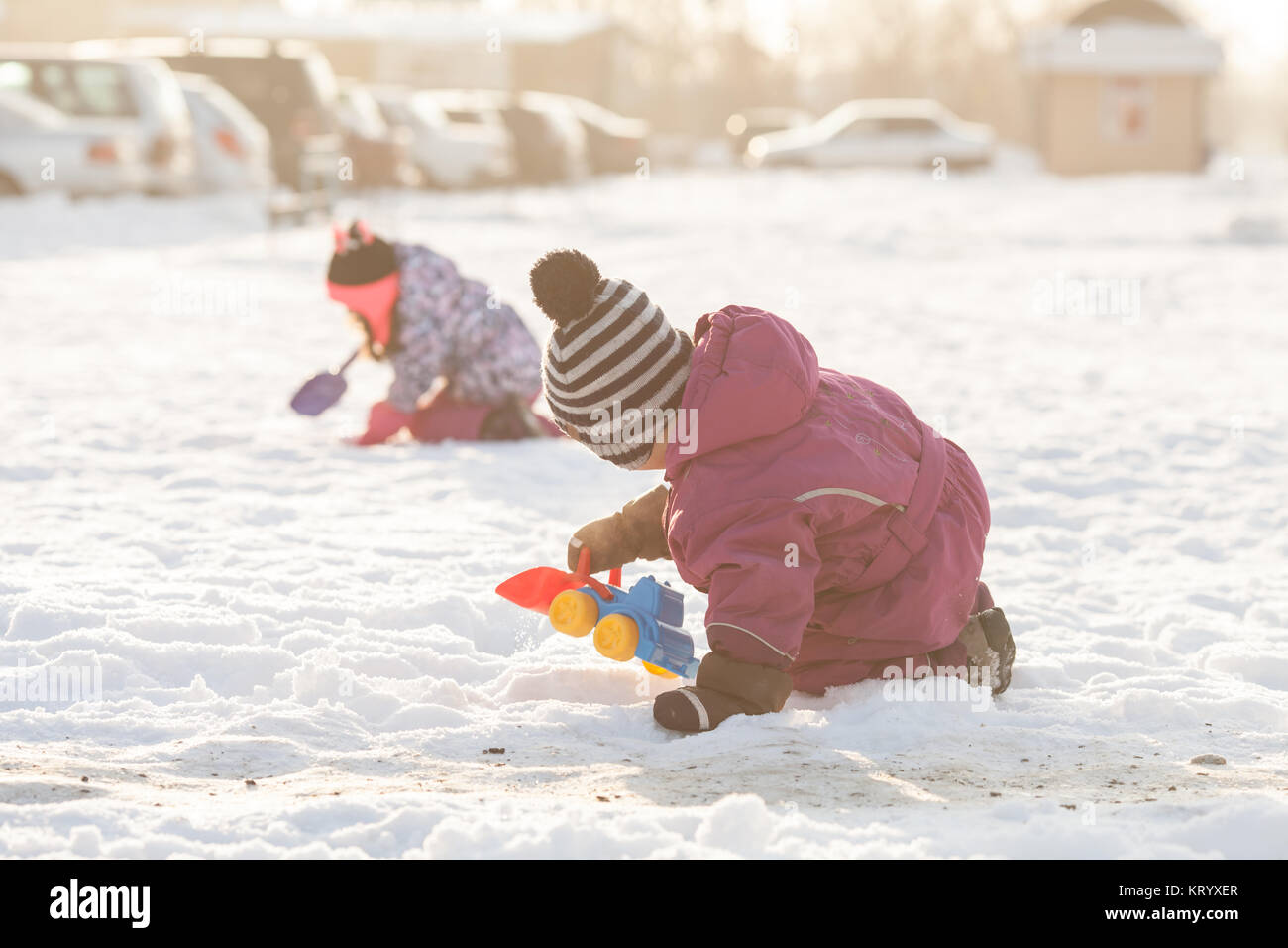 Children play on the snow Stock Photo - Alamy
