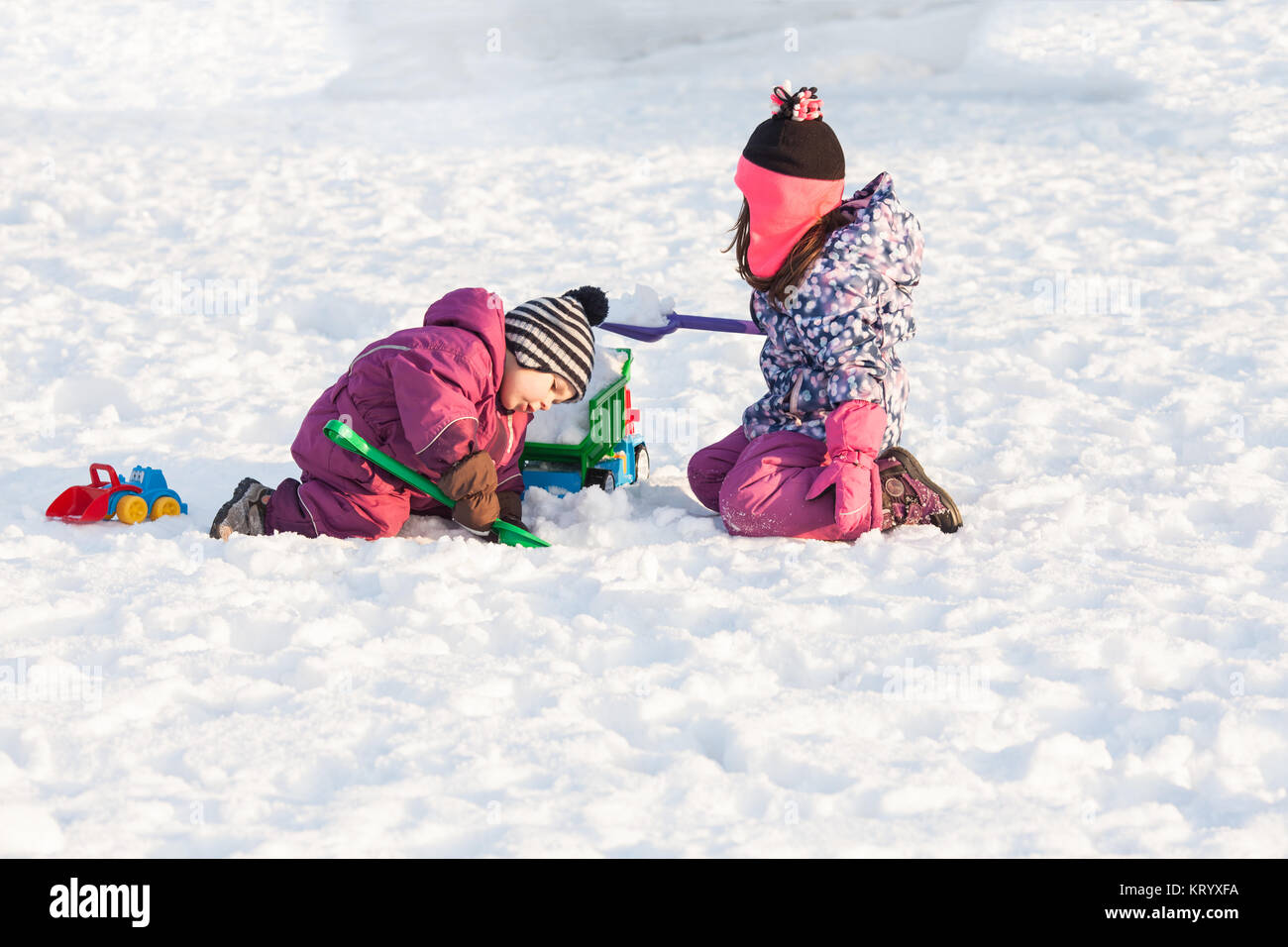 Children play on the snow Stock Photo - Alamy