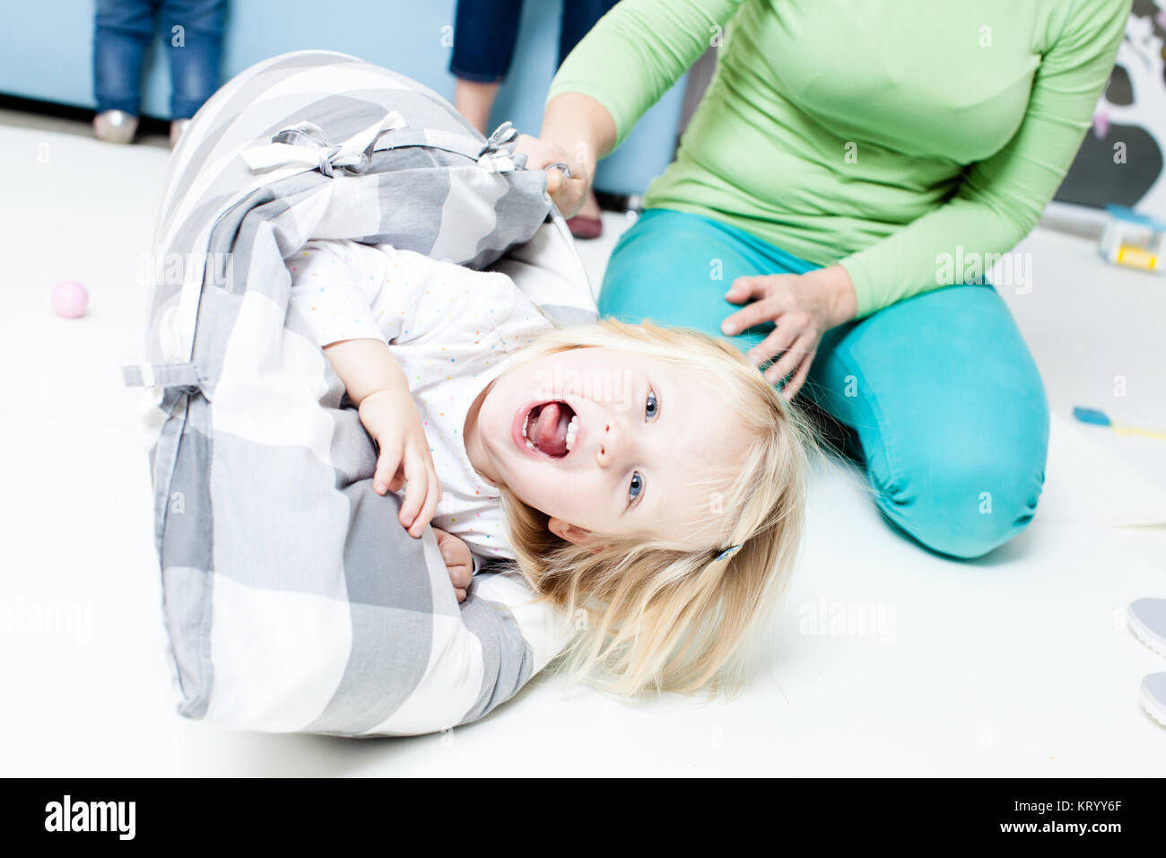 Mother is rocking her baby Stock Photo - Alamy