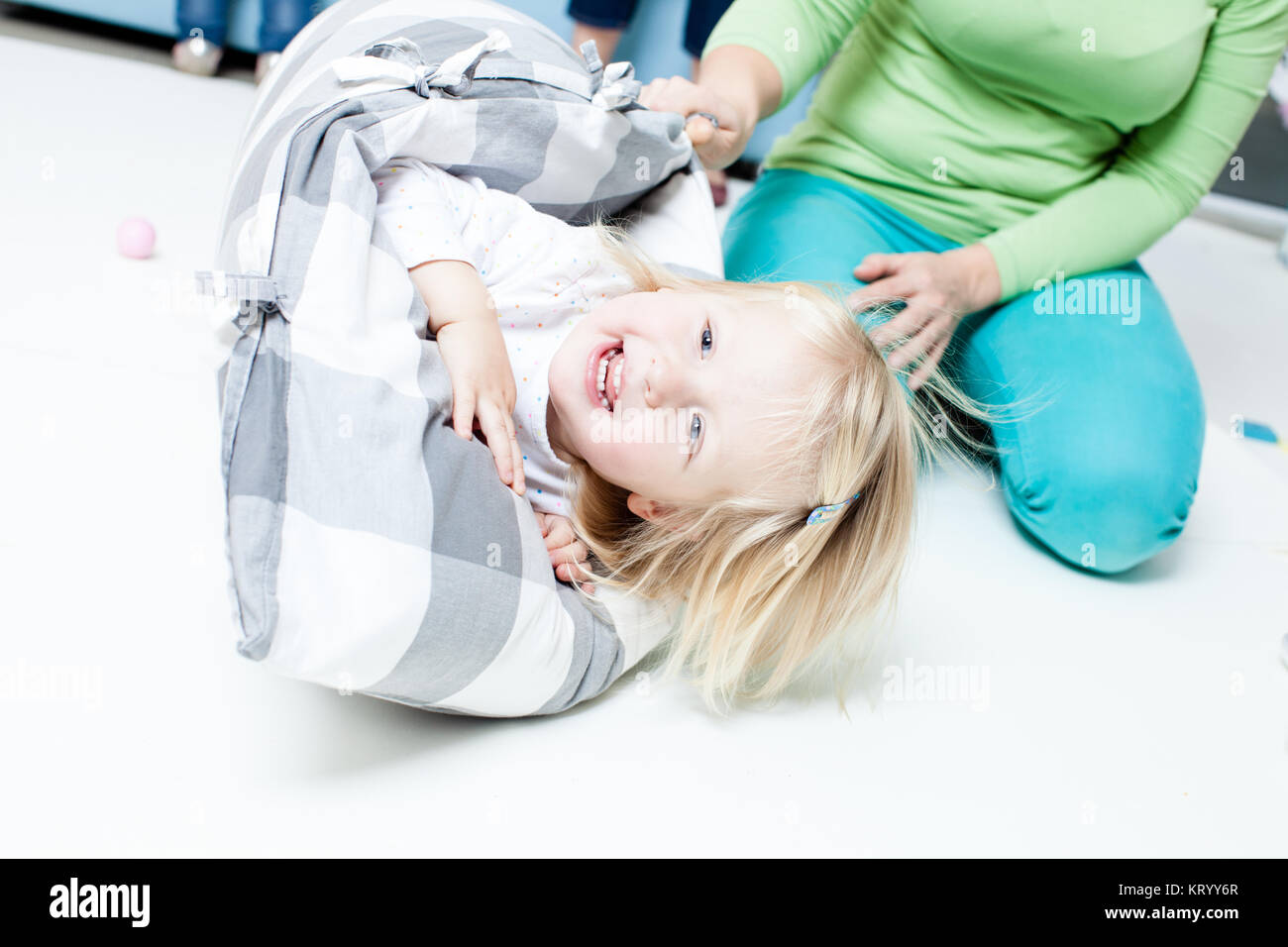 Mother is rocking her baby Stock Photo - Alamy