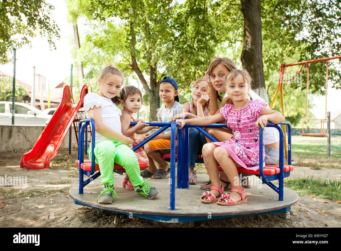 Kids on the carousel Stock Photo - Alamy