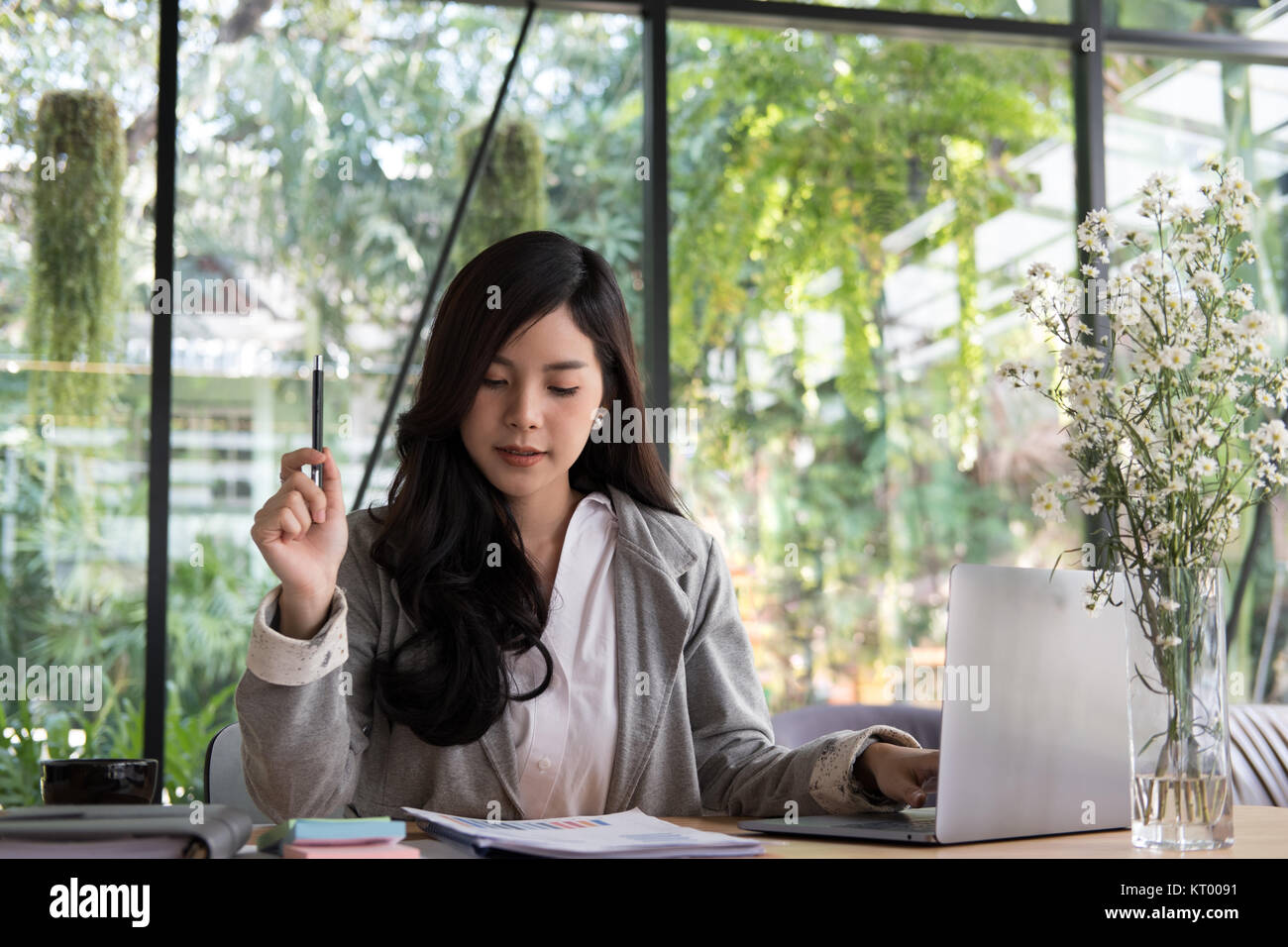 asian businesswoman using computer at workplace. startup woman working ...