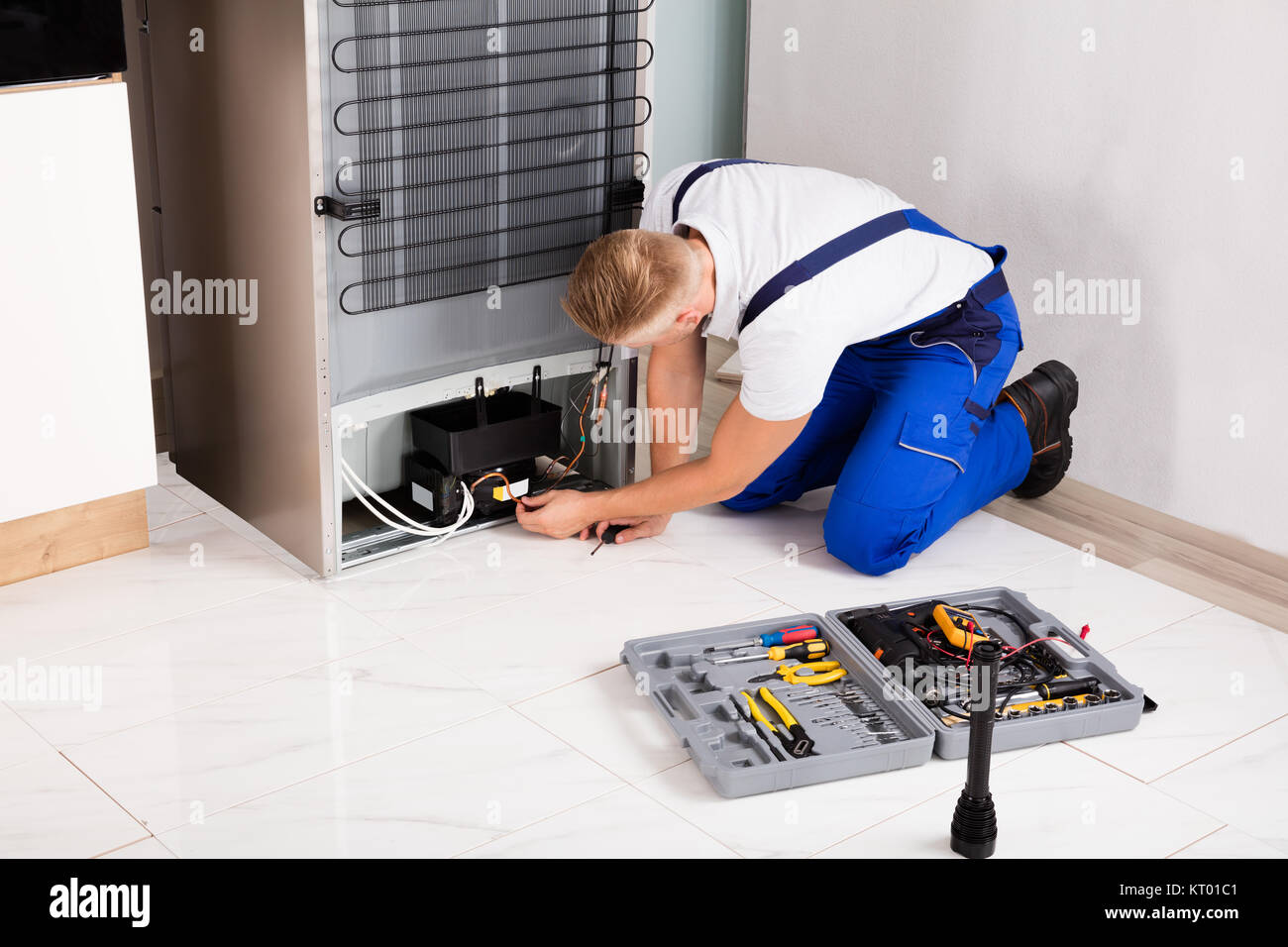 Male Technician Checking Refrigerator Stock Photo - Alamy