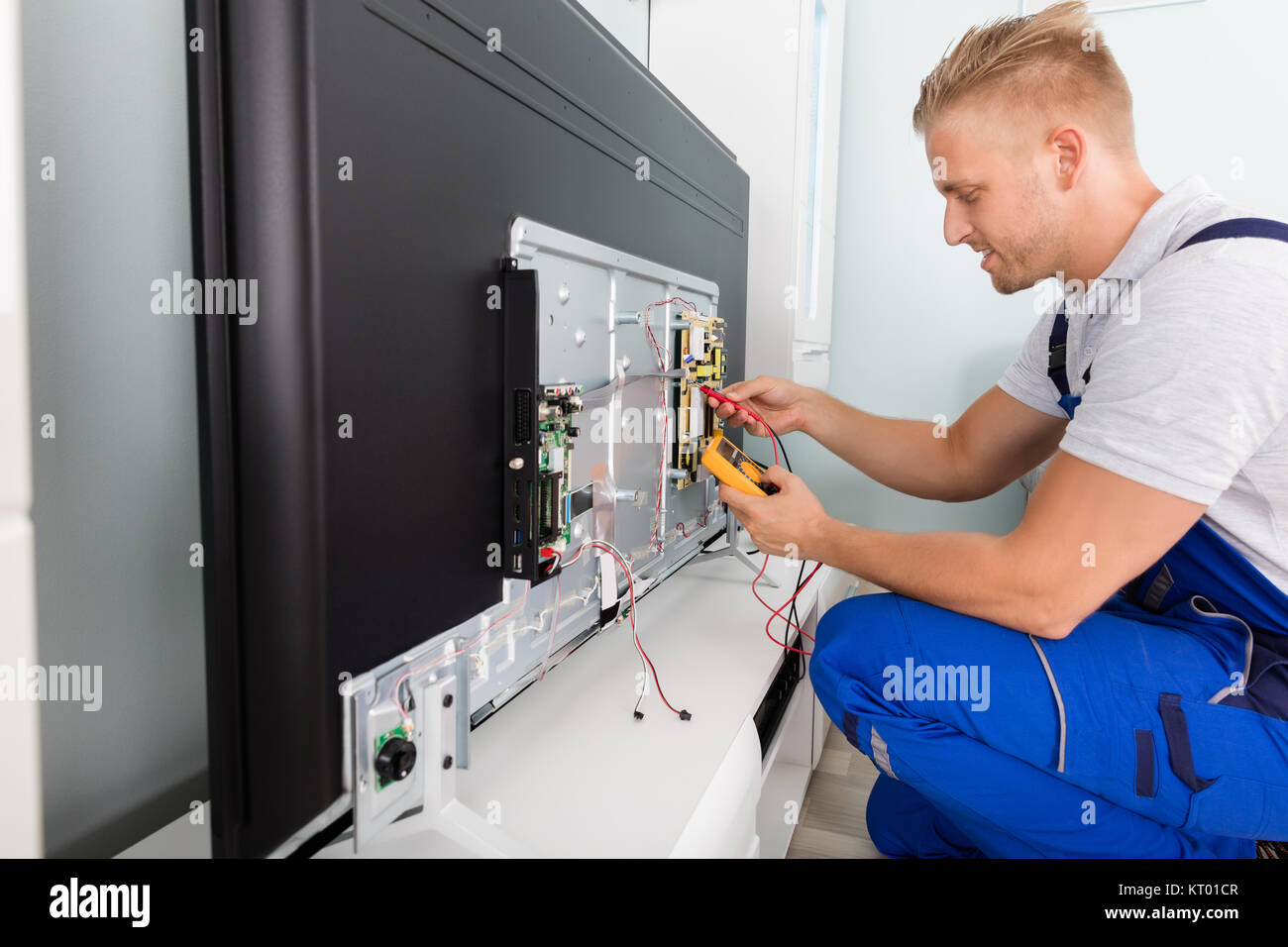 Electrician Checking Television Stock Photo - Alamy