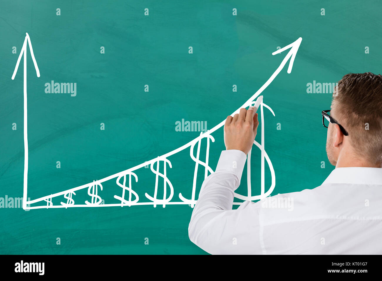 Businessman Drawing Increasing Dollar Graph Stock Photo - Alamy