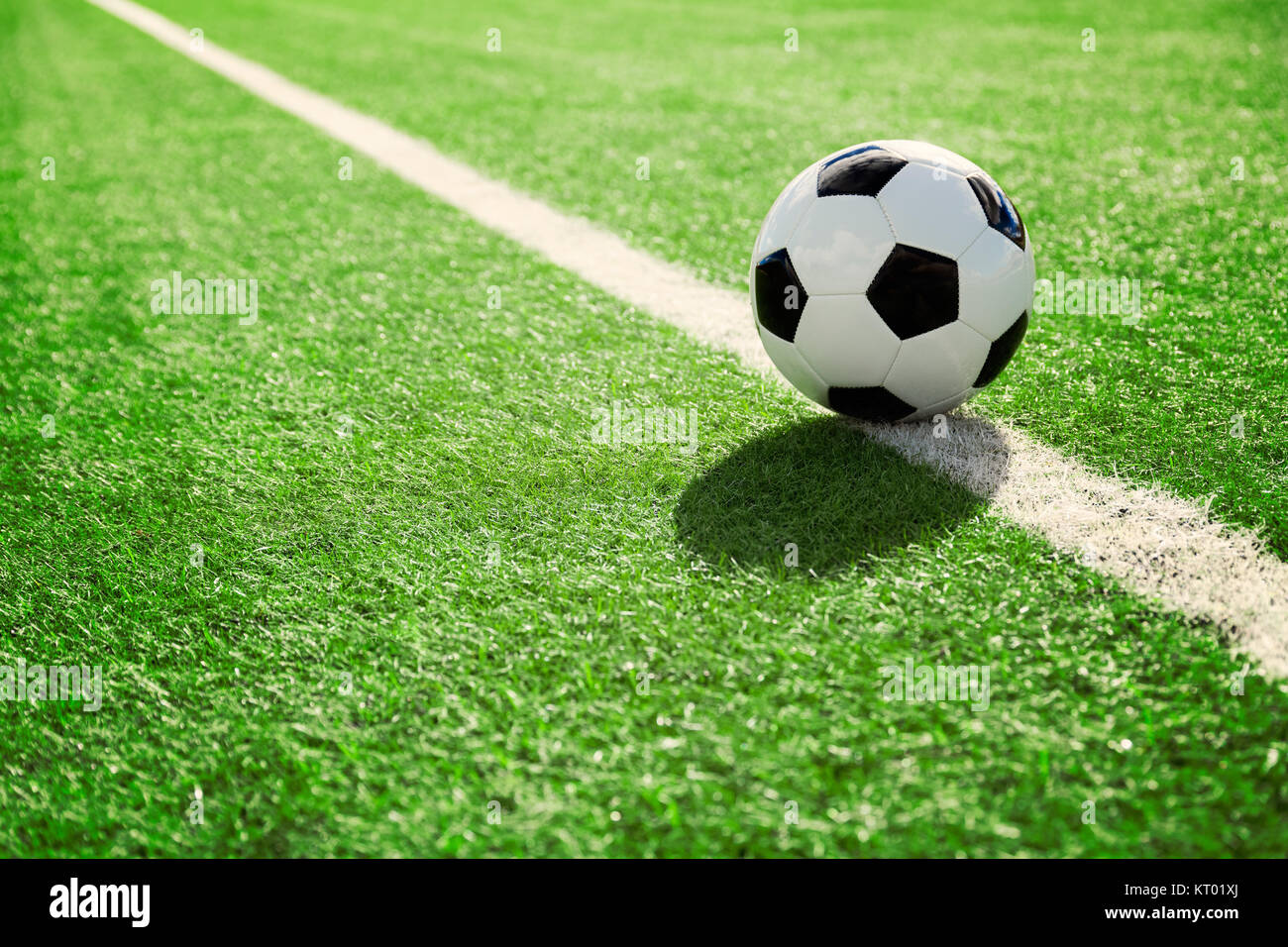Soccer ball on soccer field Stock Photo - Alamy