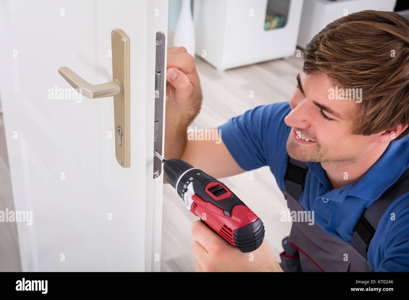Carpenter Installing Door Lock Stock Photo - Alamy