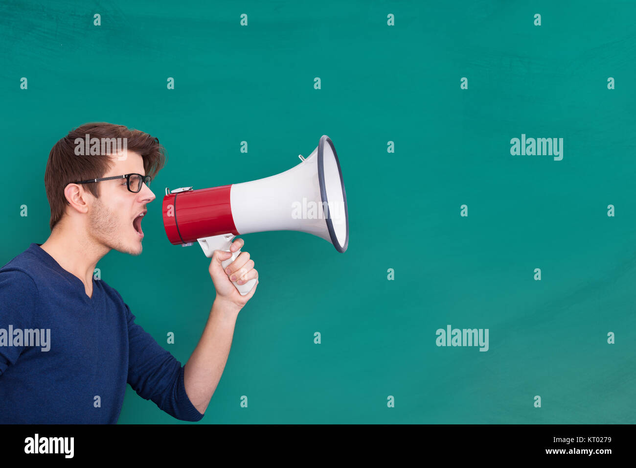 Young Man Shouting In Megaphone Stock Photo - Alamy