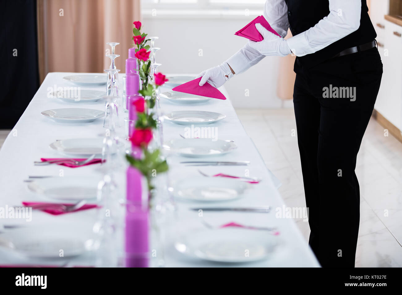 Male Waiter Placing Napkin Stock Photo - Alamy