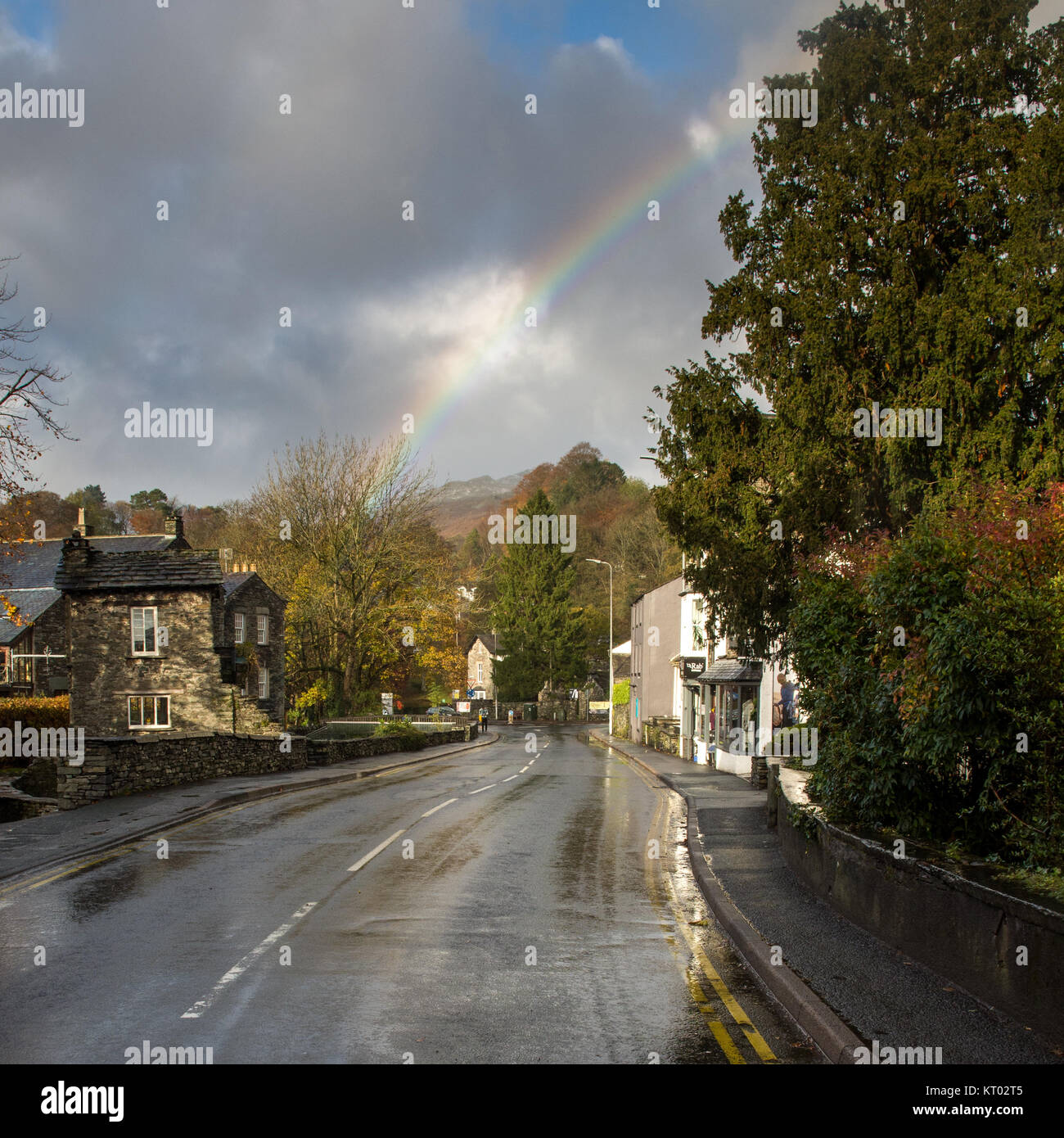 A rainbow over the A591 main road through Ambleside town in England's ...