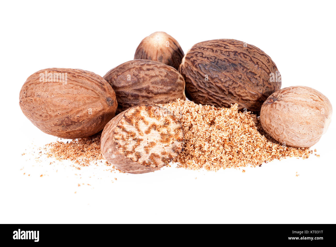 Nutmeg , half and ground on white background, close up Stock Photo - Alamy