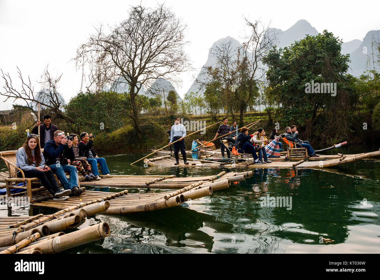 Guilin, China - Jan 29, 2013: Tourists taking bamboo raft rides during ...