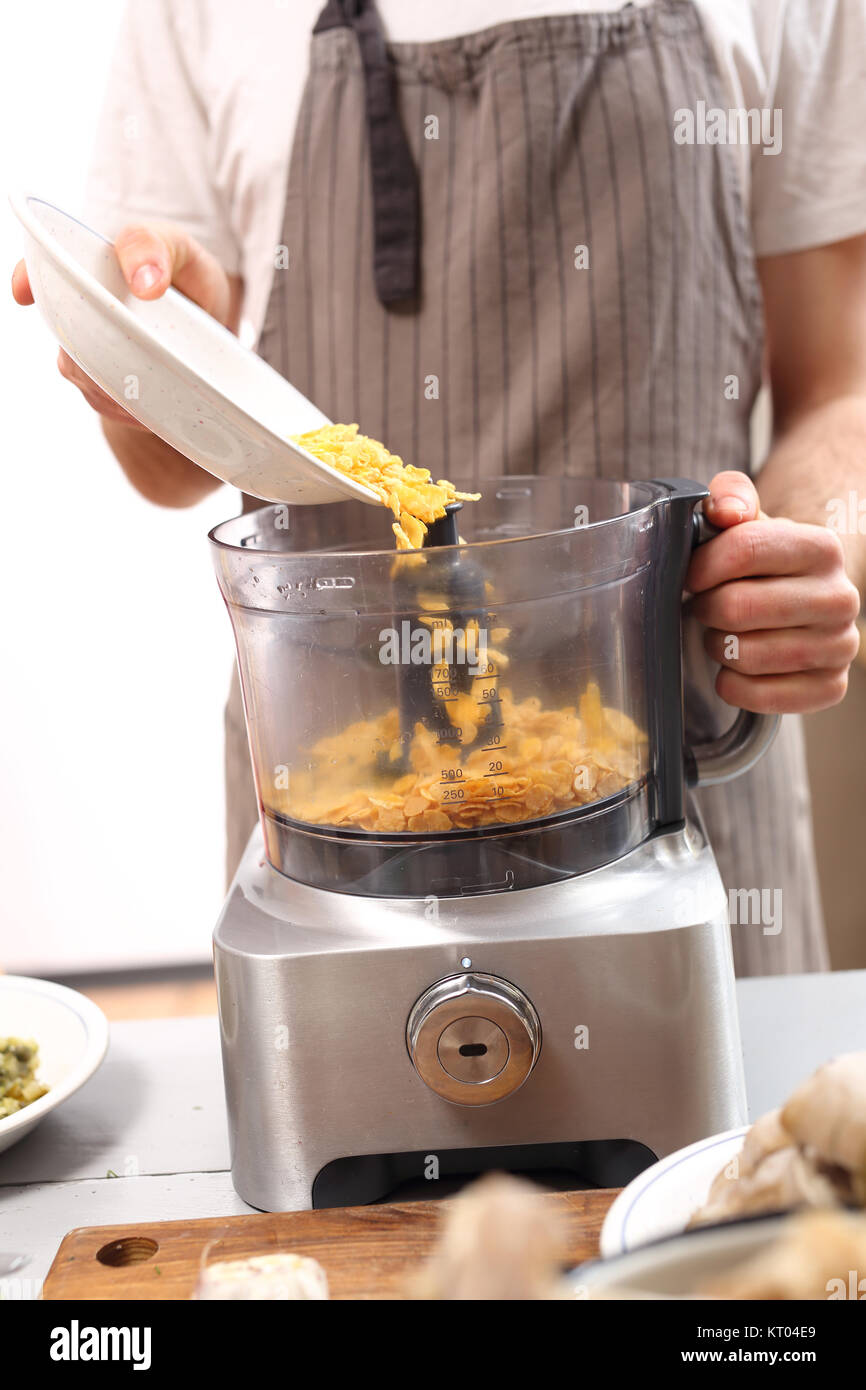 cook. young chef prepares vegetable vegan dish Stock Photo - Alamy