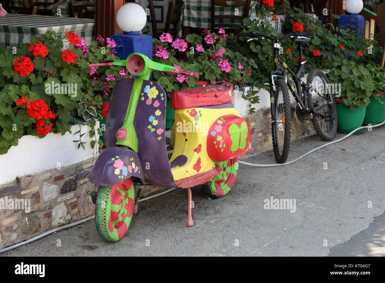 Rejuvenated colors and flowers motorcycle Stock Photo - Alamy