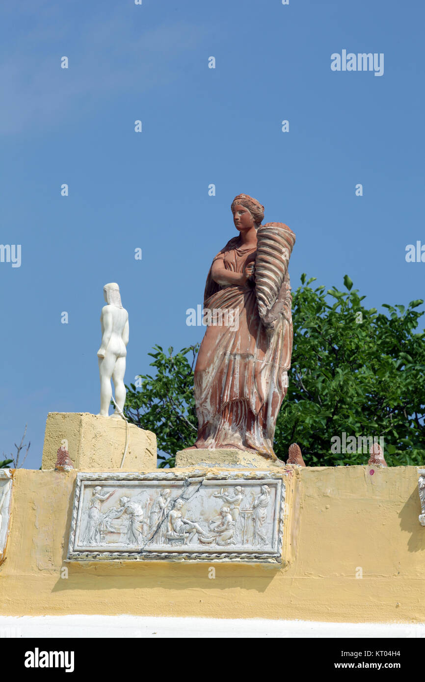 Sculptures on the roof of a house in a traditional Greek village of Zia ...
