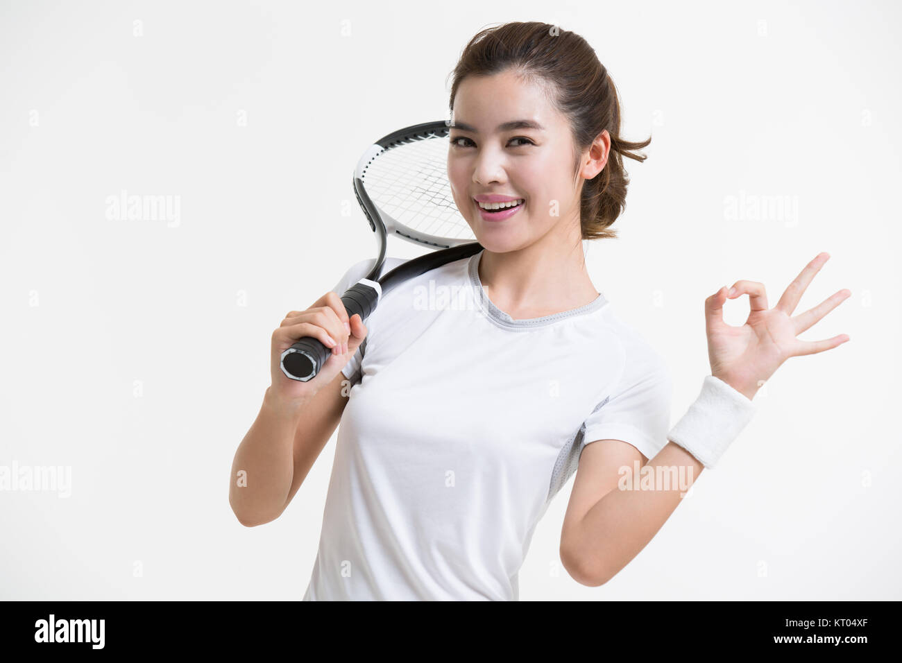 Young woman posing with tennis racket Stock Photo - Alamy