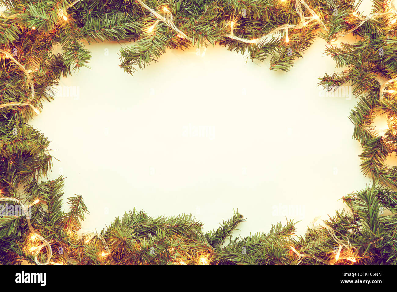 Branches of conifer with garland Stock Photo - Alamy