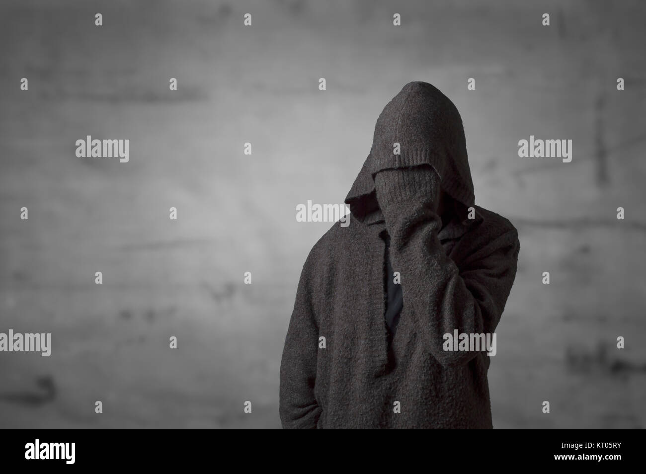 Celebrity is hiding face with a hand from paparazzi photographers. Stop ...