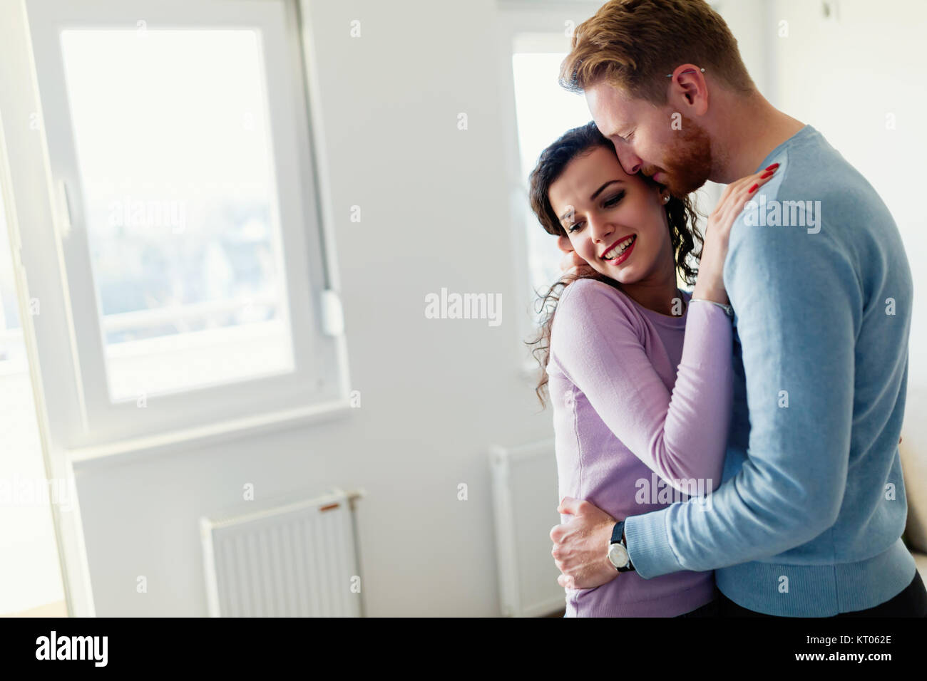 Young happy couple having romantic times at home Stock Photo - Alamy