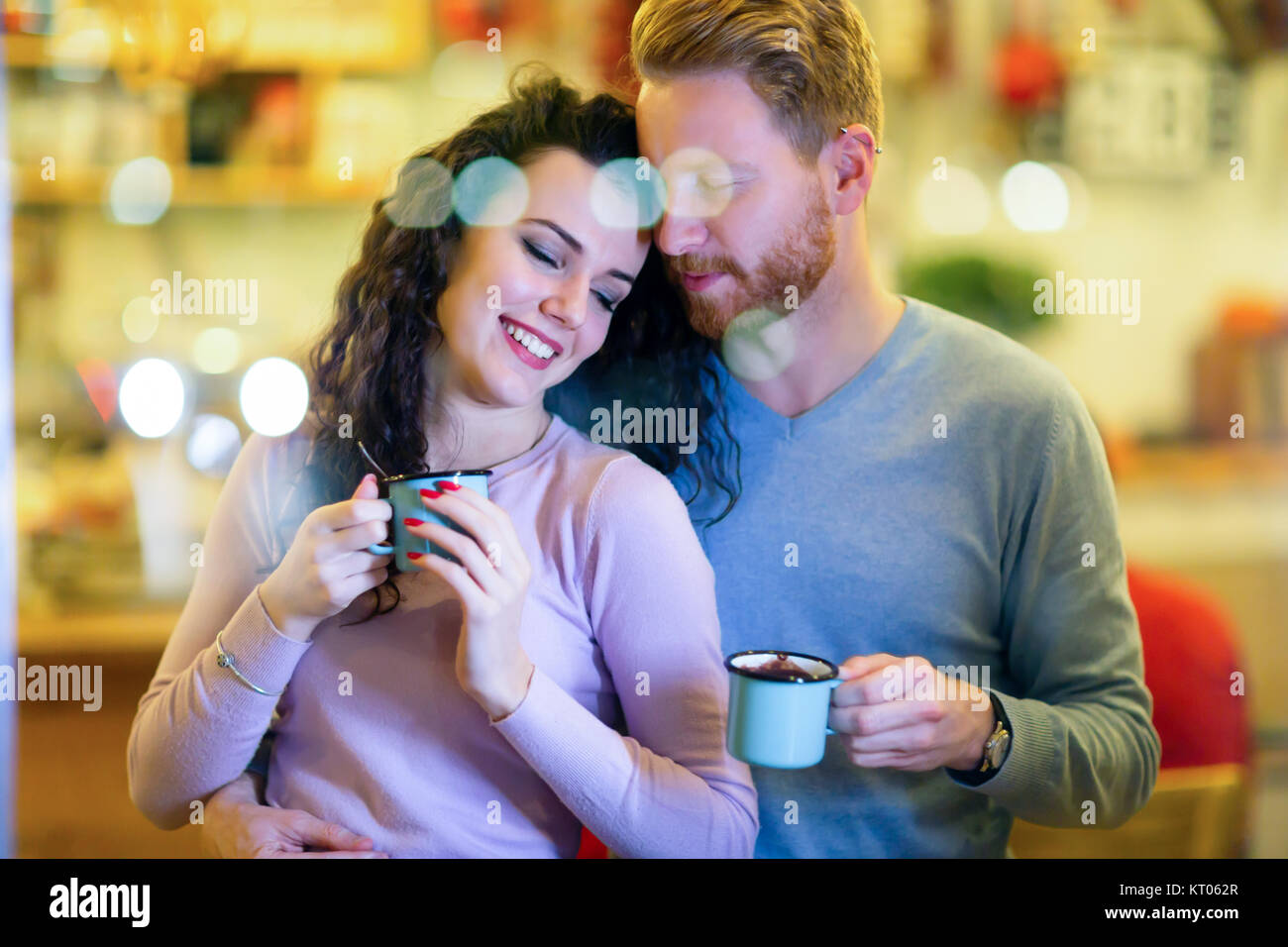 Romantic couple having date in coffee shop Stock Photo - Alamy
