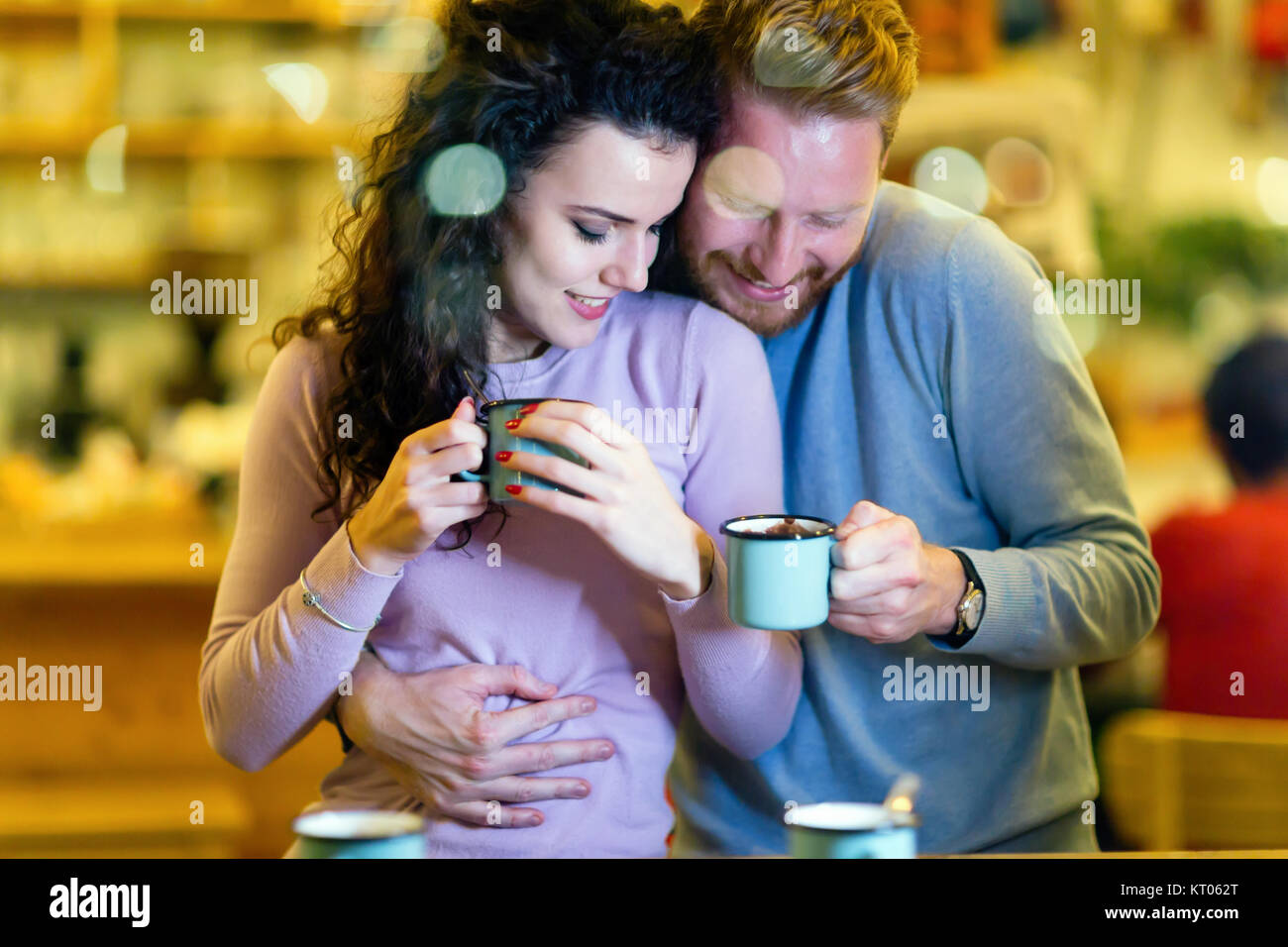 Romantic couple having date in coffee shop Stock Photo - Alamy