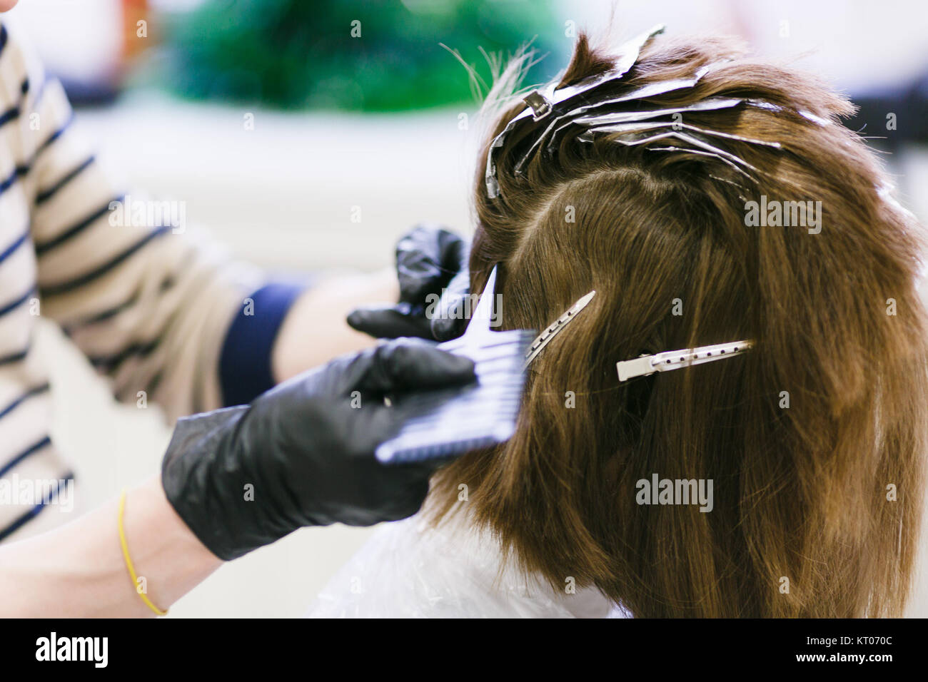 Stylist hairdresser makes hair coloring hi-res stock photography and ...