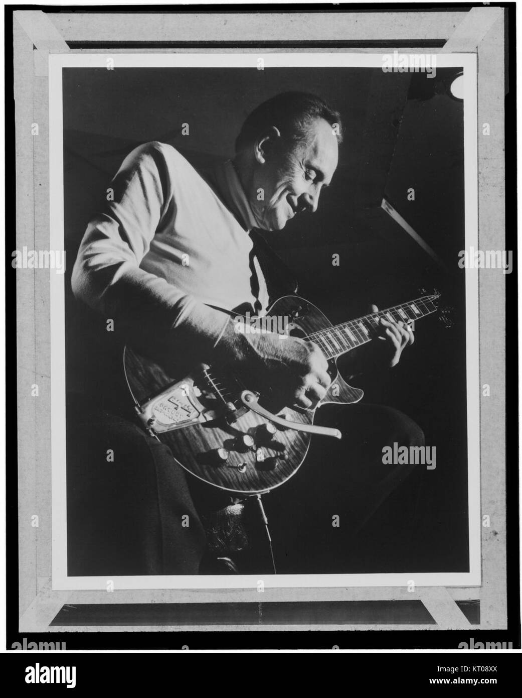 This portrait captures Les Paul, a legendary guitarist, during a ...