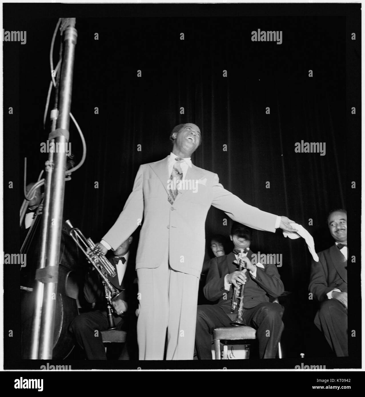 This portrait captures the legendary jazz musician Louis Armstrong ...