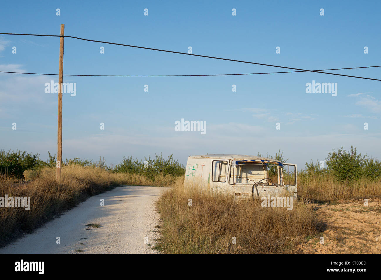 White van dumped in the countryside by a country road Stock Photo - Alamy