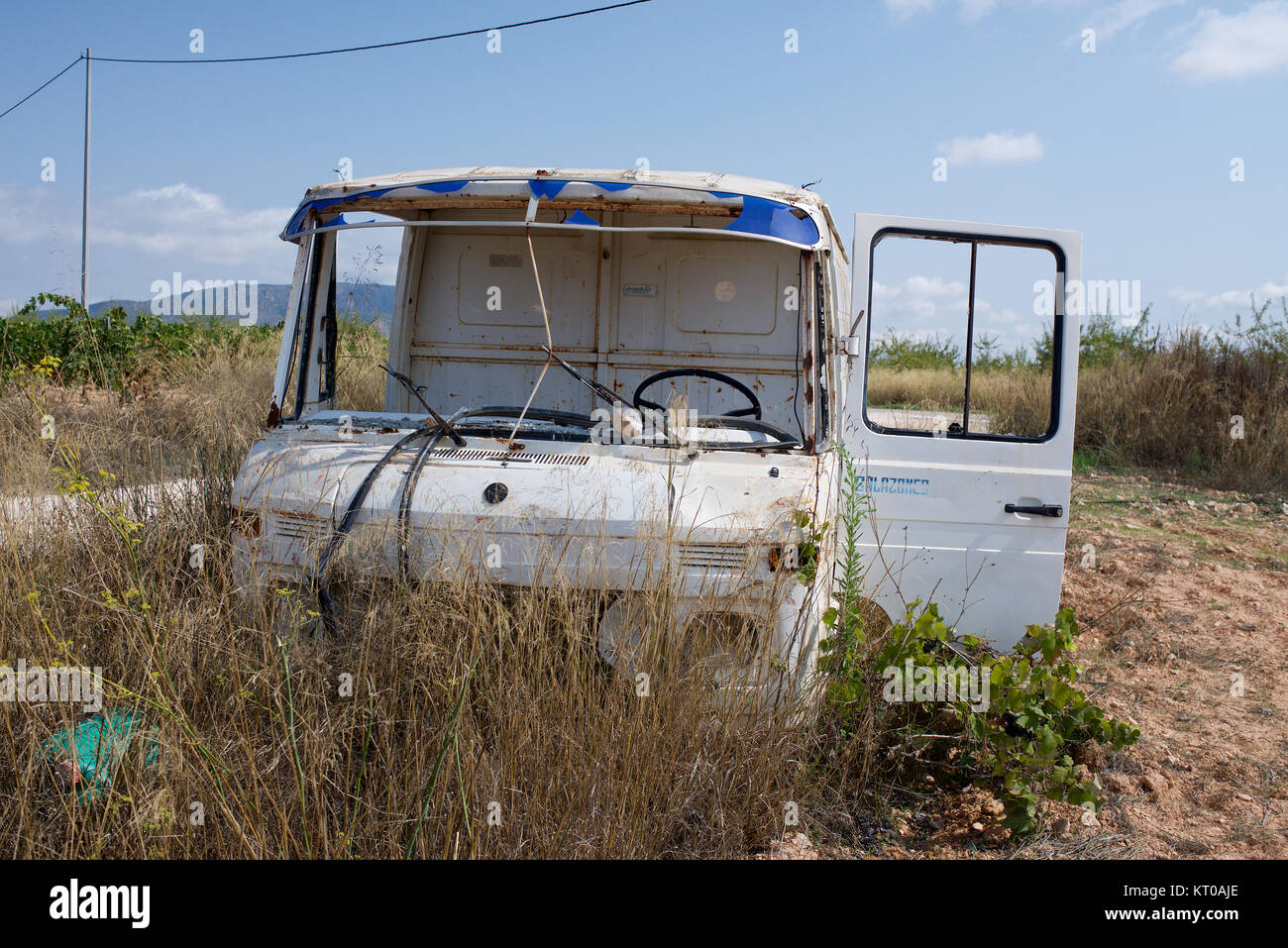 White van dumped in the countryside by a country road Stock Photo - Alamy