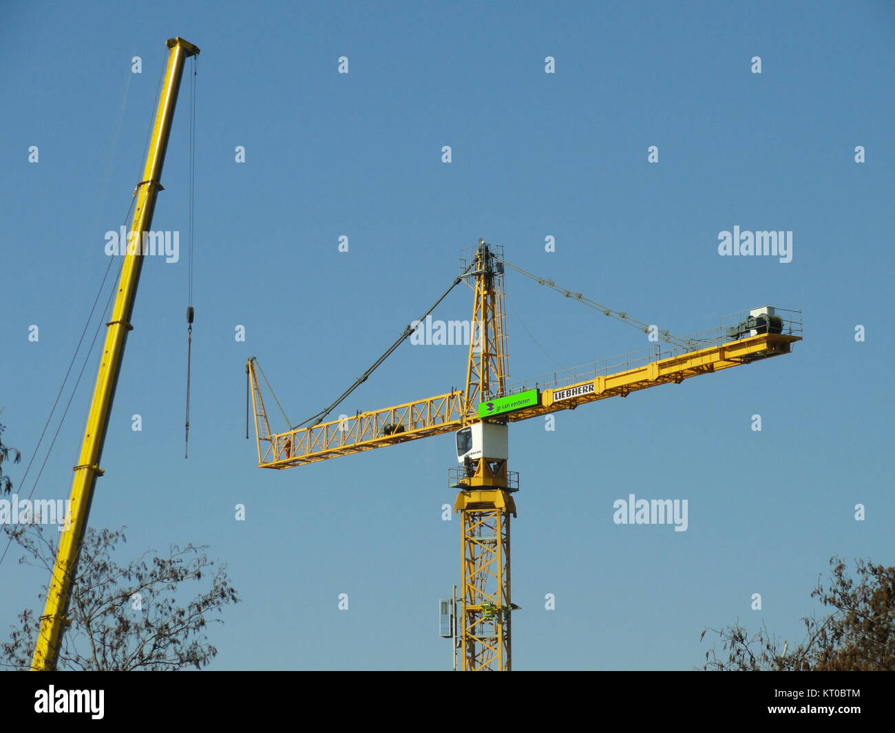 An image depicting the assembly process of a Liebherr tower crane ...