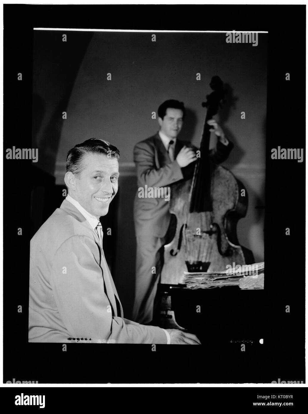 This portrait features Stan Kenton, a prominent American jazz musician ...