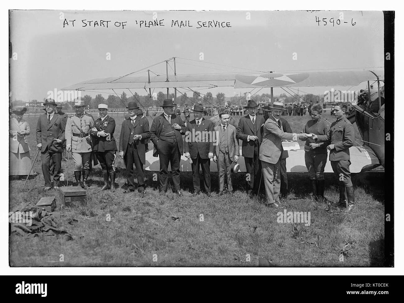 A historic image marking the beginning of plane mail service, an ...
