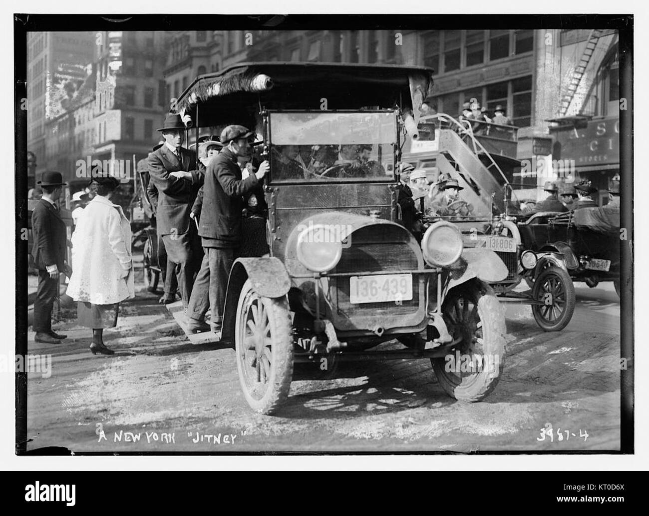 The image titled 'A N.Y. Jitney' depicts a historic scene from New York ...