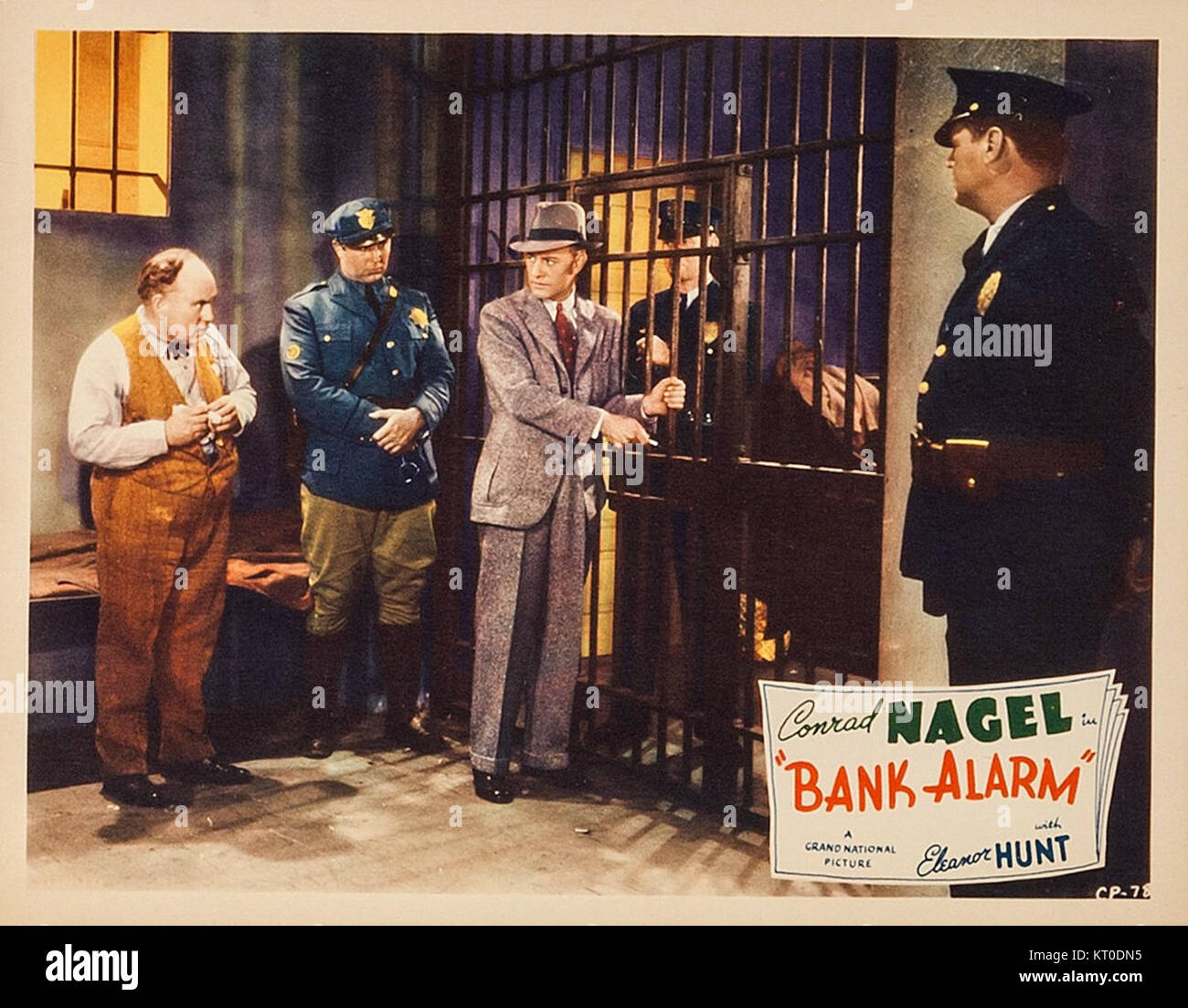 The *Bank Alarm* lobby card 6 promotes the 1937 film *Bank Alarm*. The ...