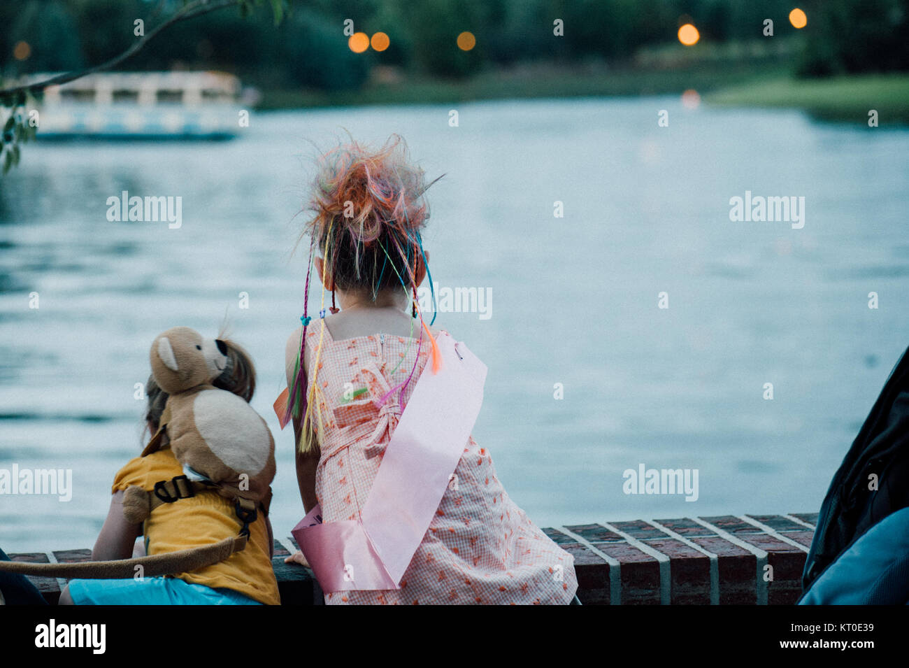 Young kids having fun playing together at the amusement park of Disney ...