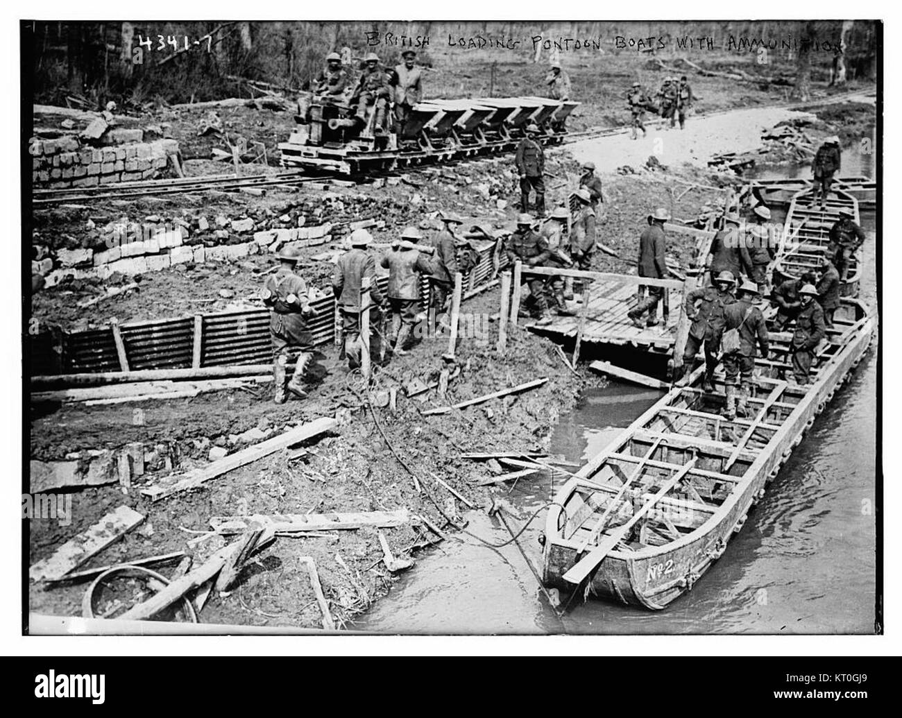 This image shows British soldiers loading pontoon boats with ammunition ...