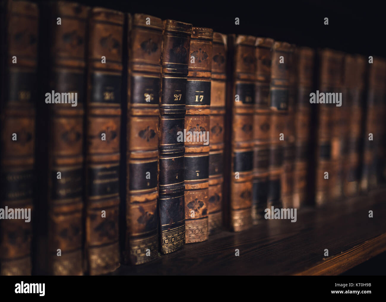 An antique collection of Voltaire books sitting on a bookshelf. Title ...