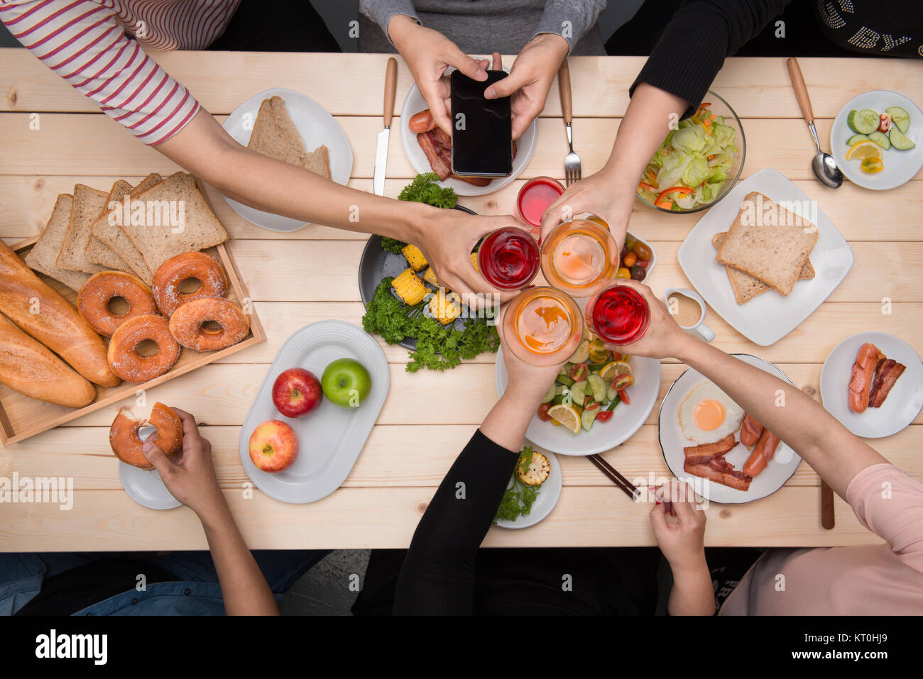 Enjoying dinner with friends. Top view of group of people having dinner ...