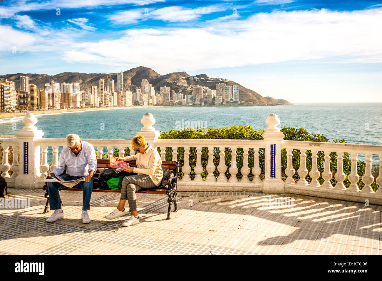 Eldery couple relax sitting on the bench in Mediterranean Balcony in ...