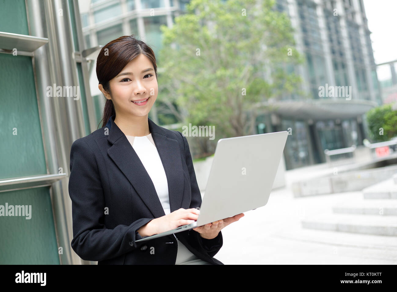 Businesswoman use of laptop computer Stock Photo - Alamy