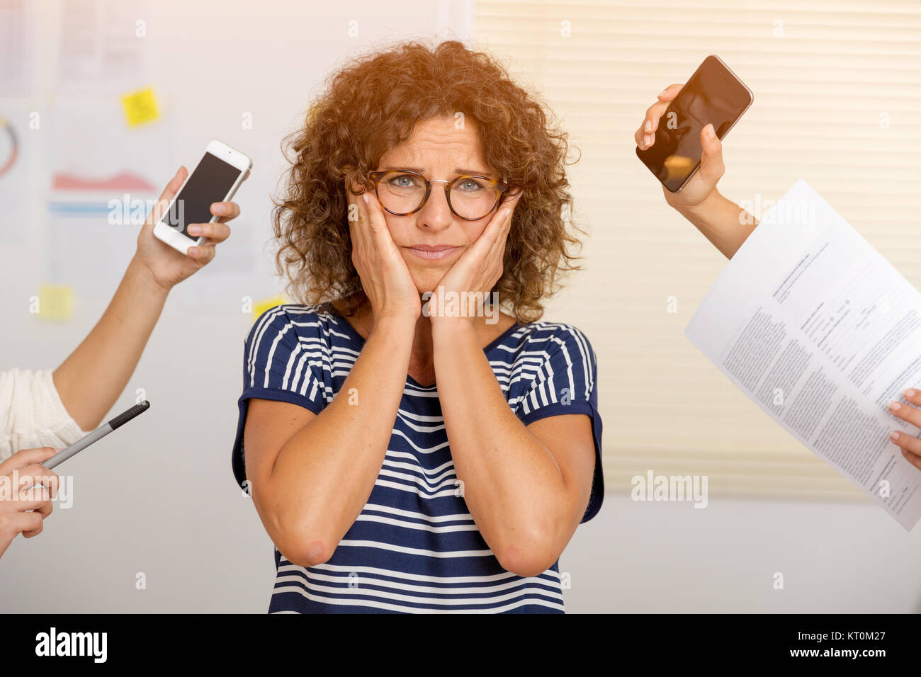 Busy woman at the office Stock Photo - Alamy