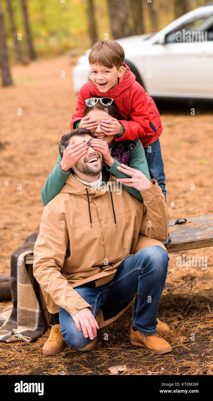 Happy family playing in autumn forest Stock Photo - Alamy