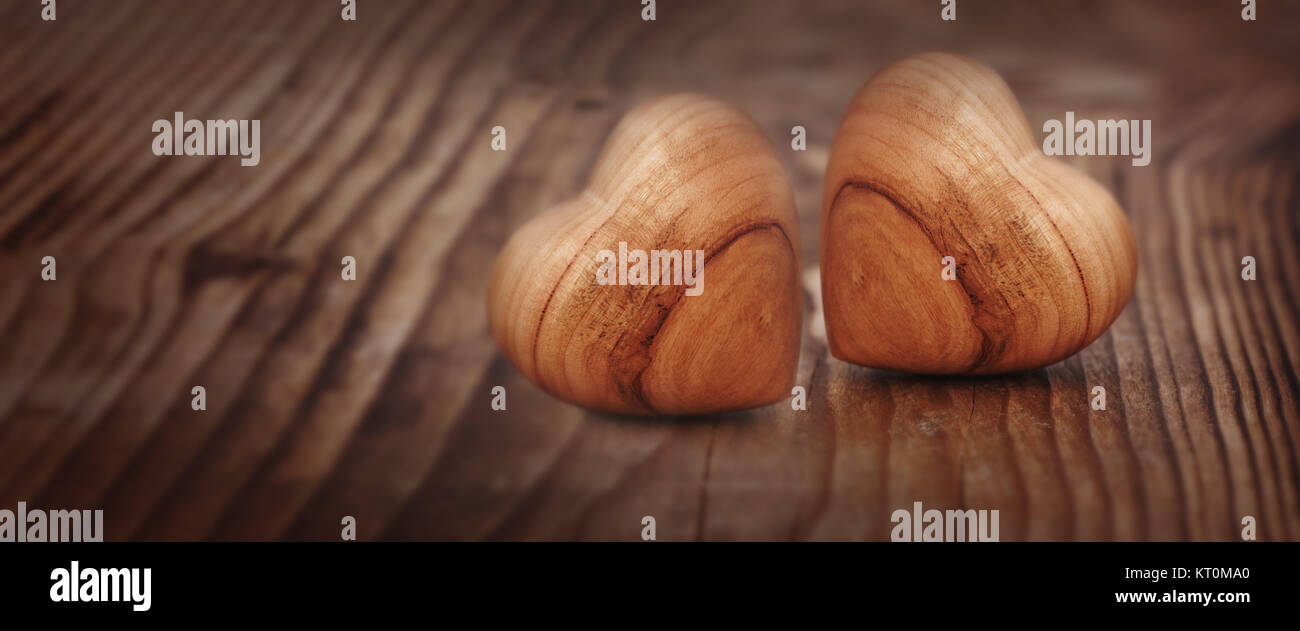 Two hearts on wood for a valentines day Concept Stock Photo - Alamy