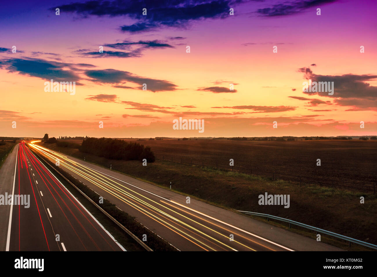 Cars speeding on a highway Stock Photo - Alamy