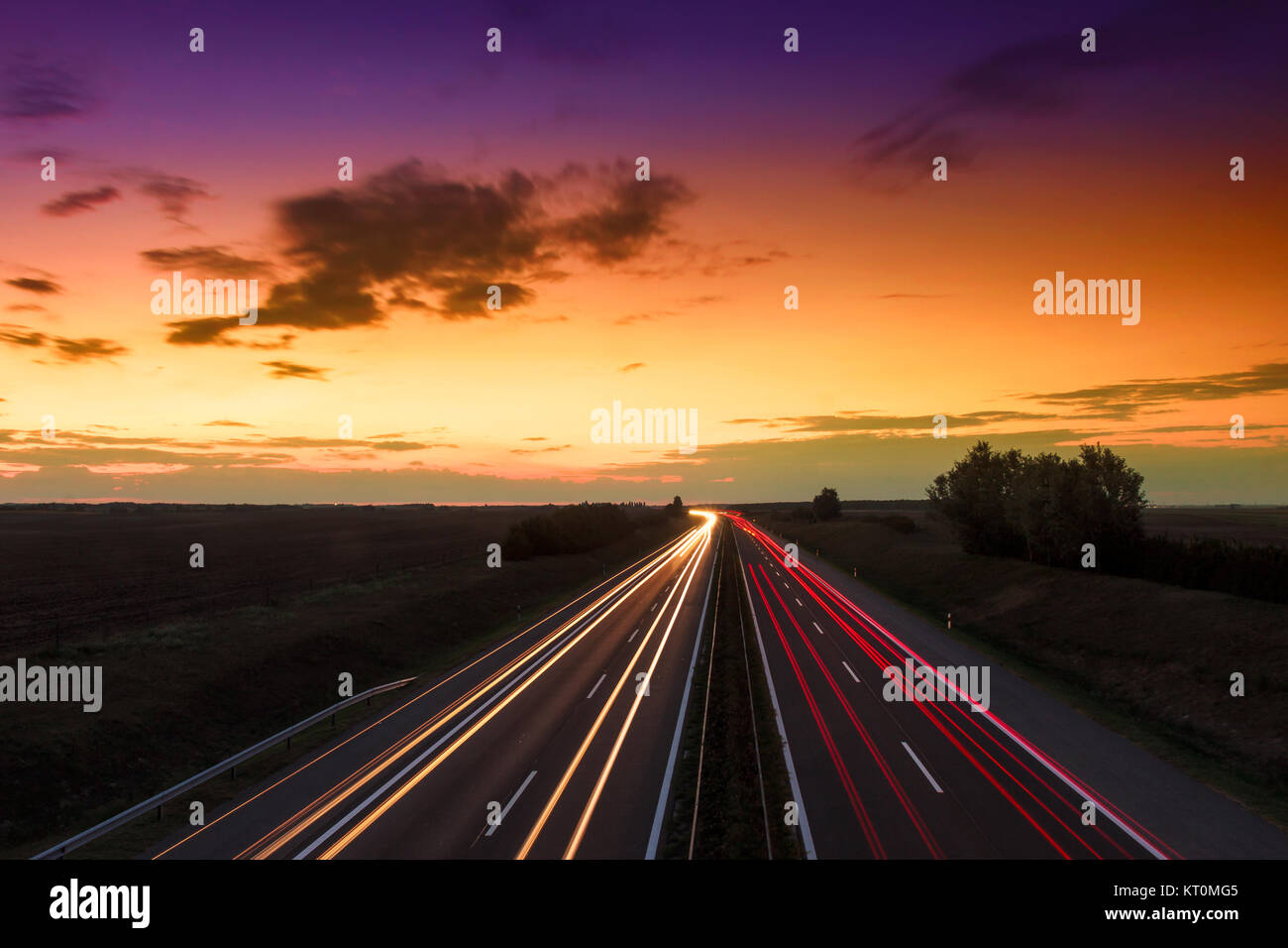 Cars speeding on a highway Stock Photo - Alamy
